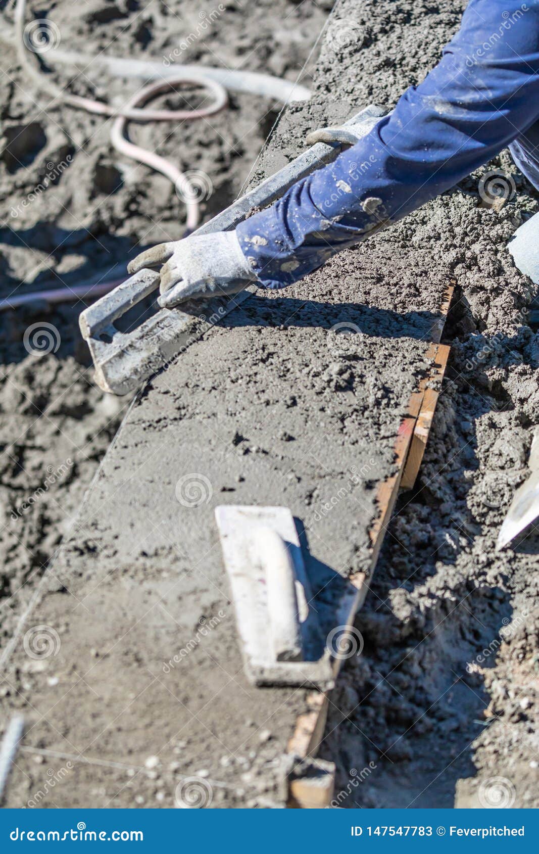 Pool Construction Worker Working with a Smoother Rod on Wet Concrete ...