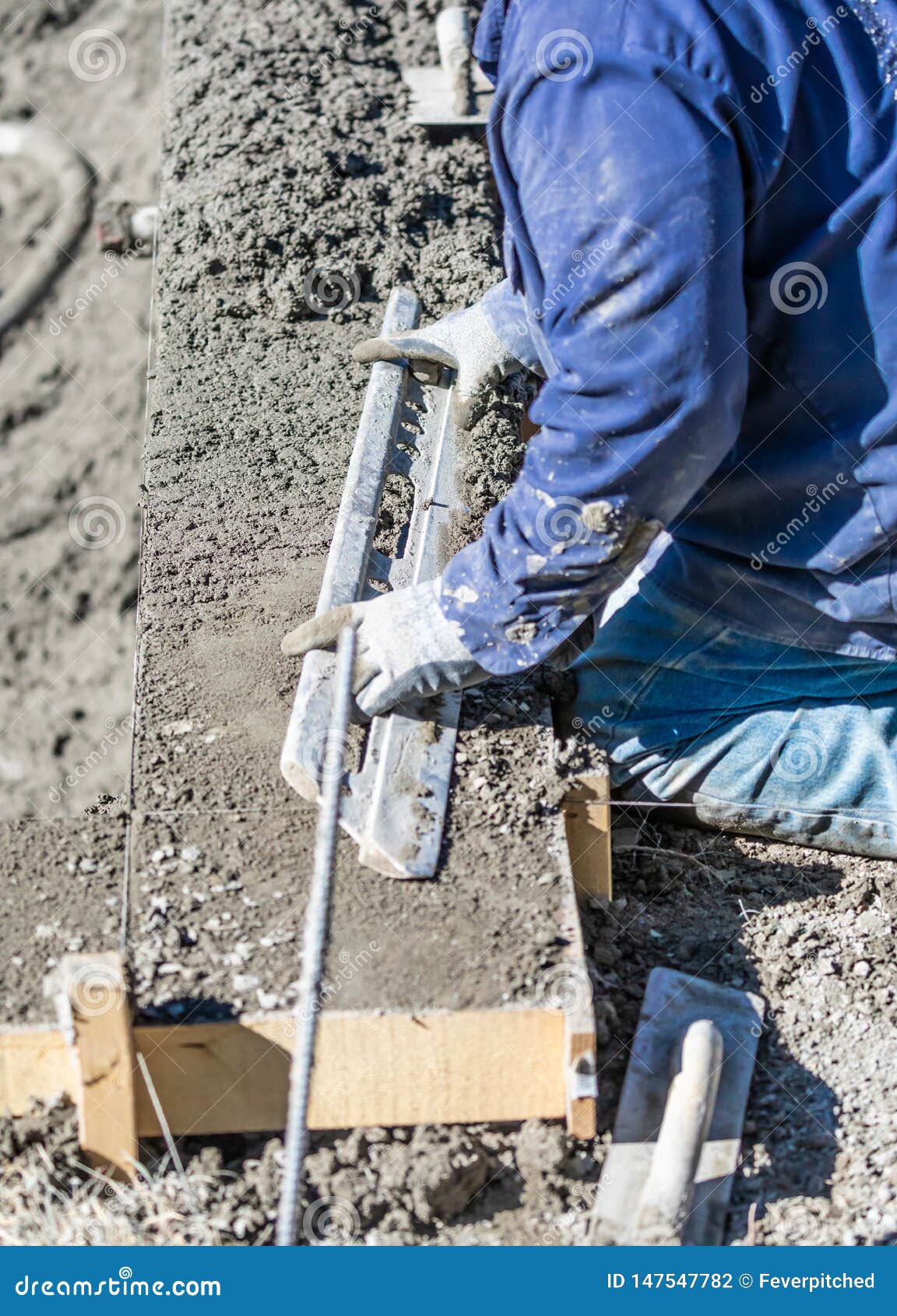 Pool Construction Worker Working with a Smoother Rod on Wet Concrete ...