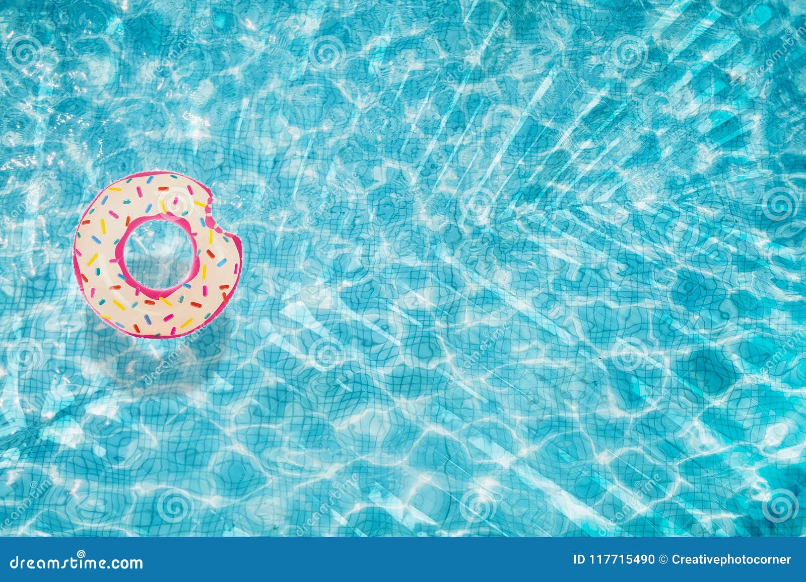 Pool Float, Ring Floating in a Refreshing Blue Swimming Pool with Palm ...