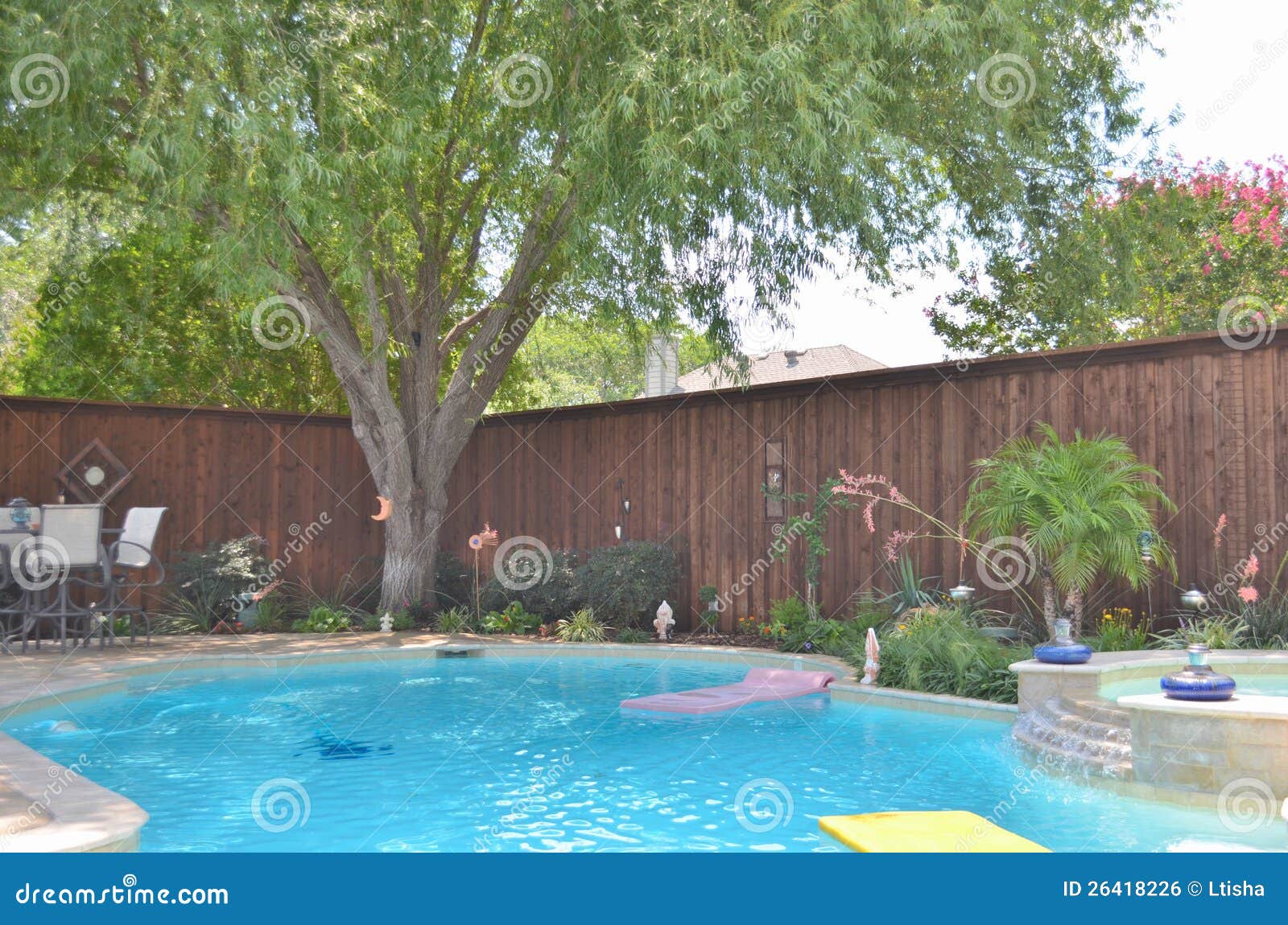 The Pool Floats stock photo. Image of landscaped, patio - 26418226