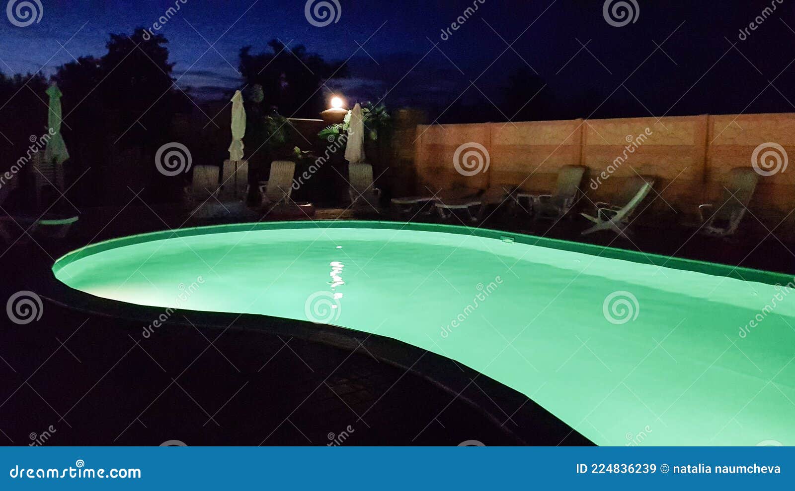 The Pool is Illuminated with Green Light at Night. Stock Image - Image ...