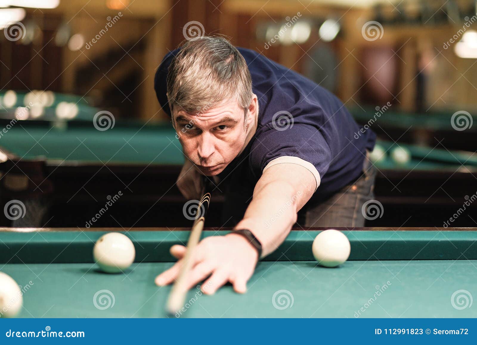 A Pool Player Takes Aim at the Ball Stock Image - Image of ...