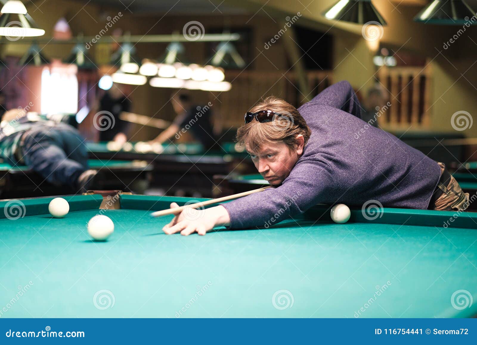 A Pool Player Takes Aim at the Ball Stock Image - Image of line ...