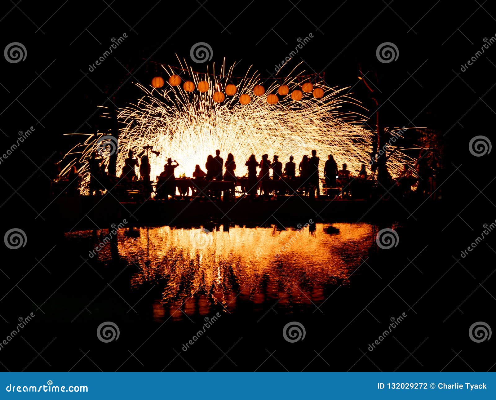 People Enjoying an Exciting Firework Display Next To a Pool Stock Photo ...