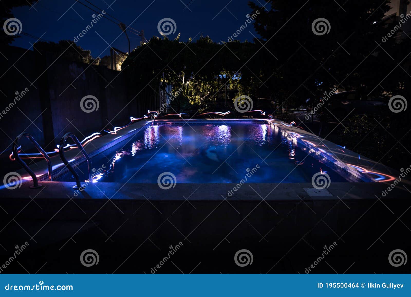 Pool and Waterfall at Night - Vacation Background. Colorful Light ...