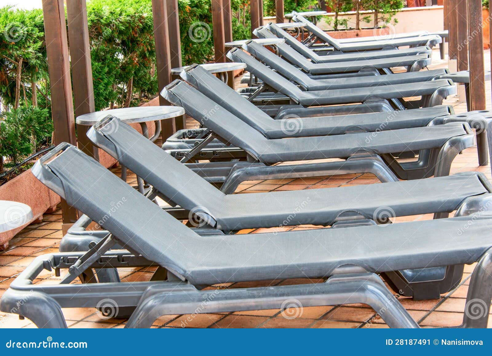 Poolside benches in line stock image. Image of poolside - 28187491
