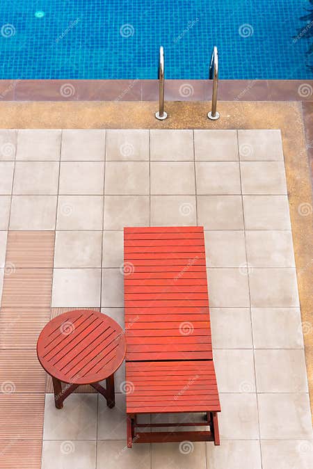 Poolside Deckchairs Alongside Blue Swimming Pool from Top View Stock ...