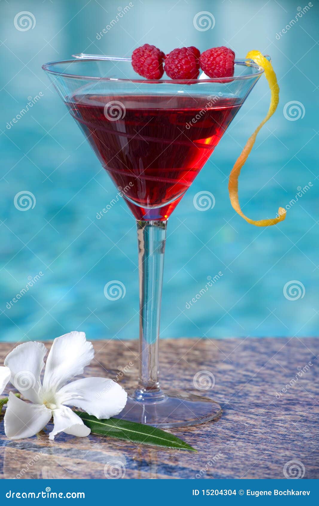 Poolside Raspberry Cosmopolitan Stock Photo - Image of icecubes ...