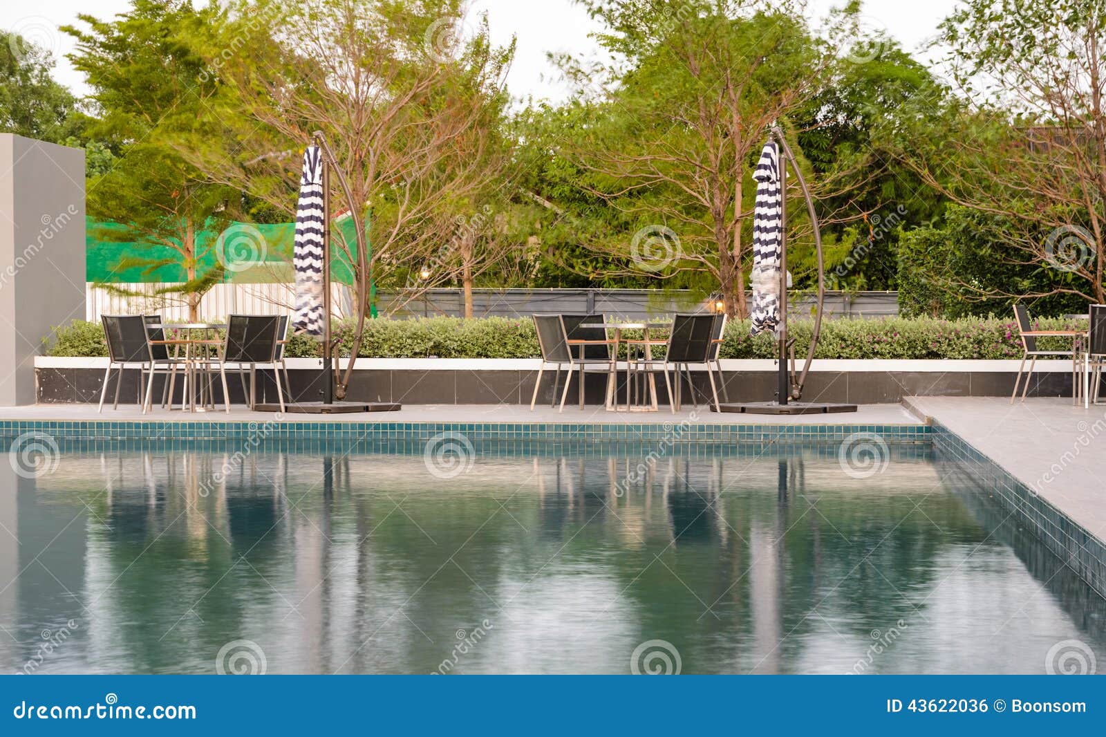 Poolside tables and chairs stock photo. Image of chair - 43622036