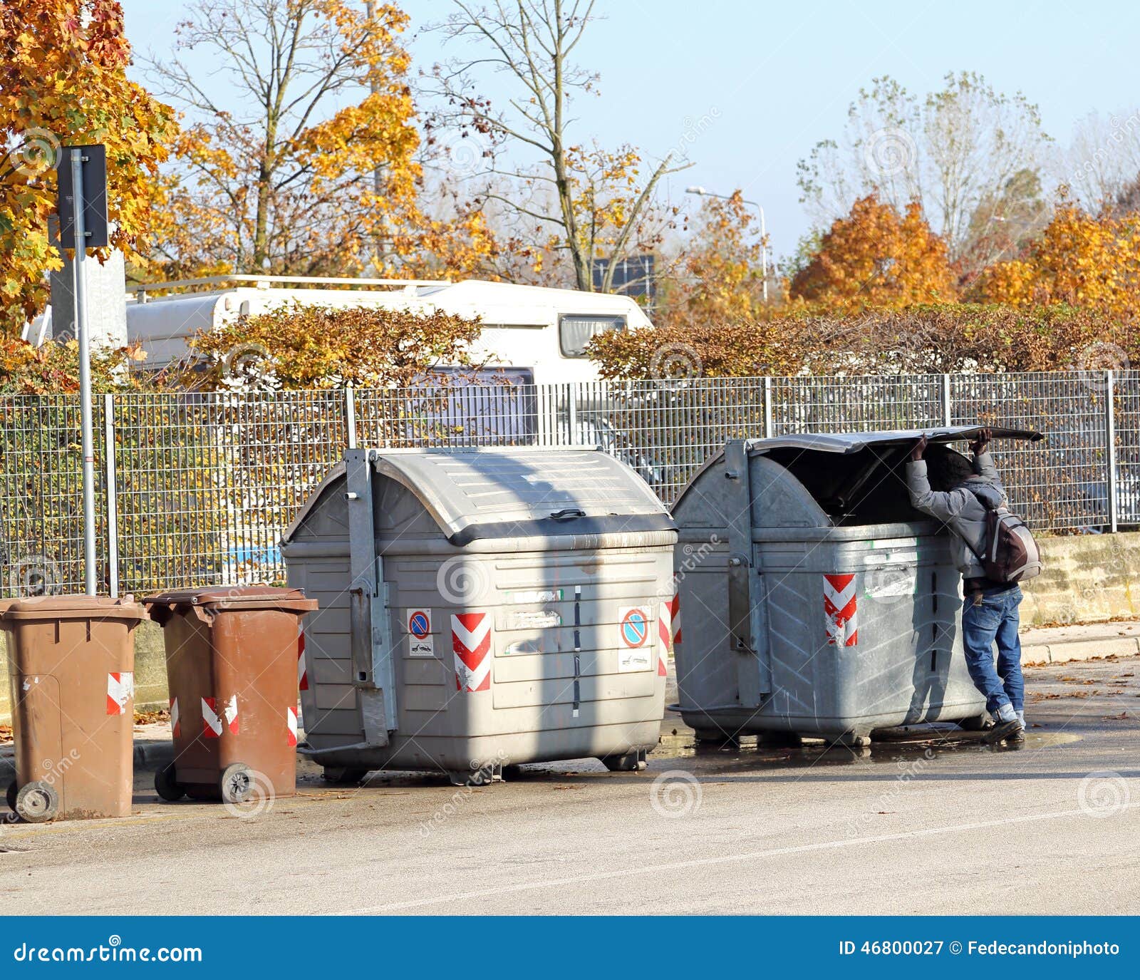 Poor African Boy is Trying Some Clothes into the Waste Box Editorial ...