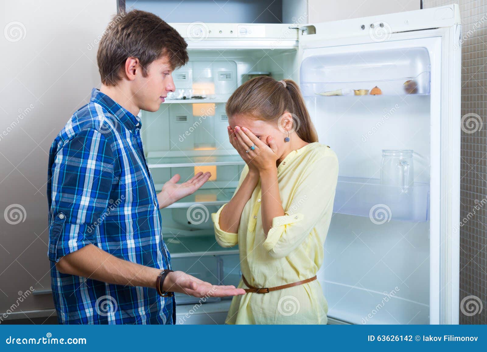Poor Couple Near Empty Fridge Stock Photo - Image of appliance ...