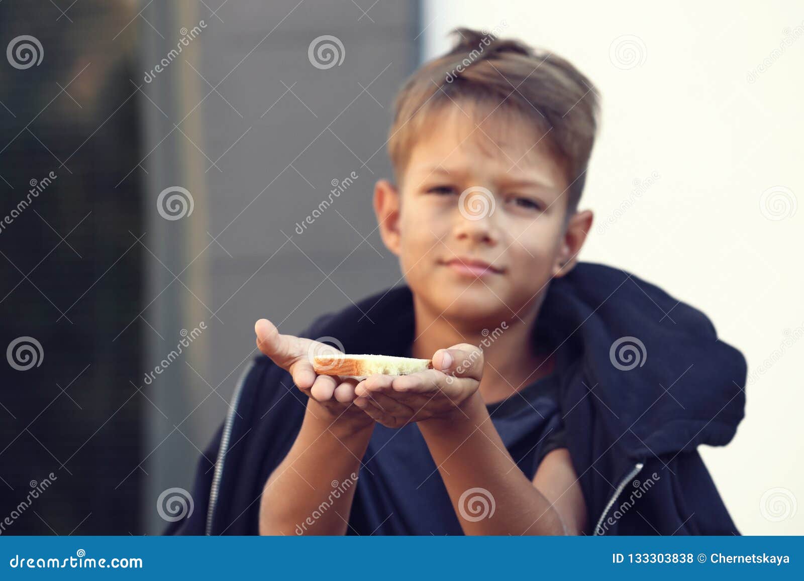 Poor Little Boy with Bread on Street Stock Photo - Image of homeless ...