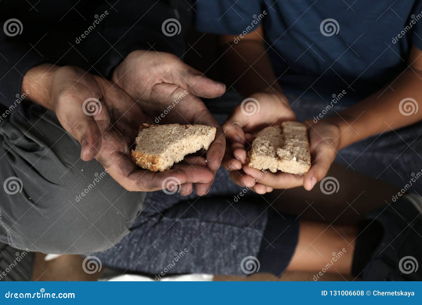 Poor Man and His Son Holding Bread, Focus Stock Photo - Image of ...