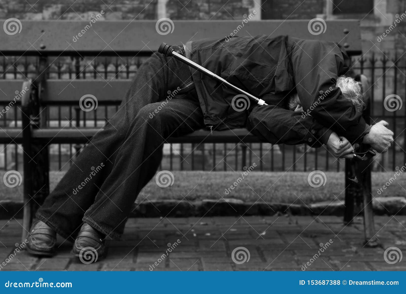 Poor man sleeping on bench editorial stock photo. Image of cold - 153687388