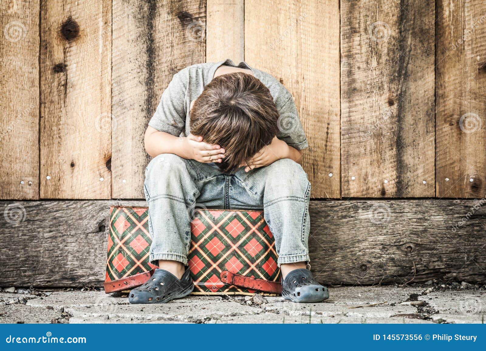 Sad Homeless Boy stock photo. Image of small, earth - 145573556
