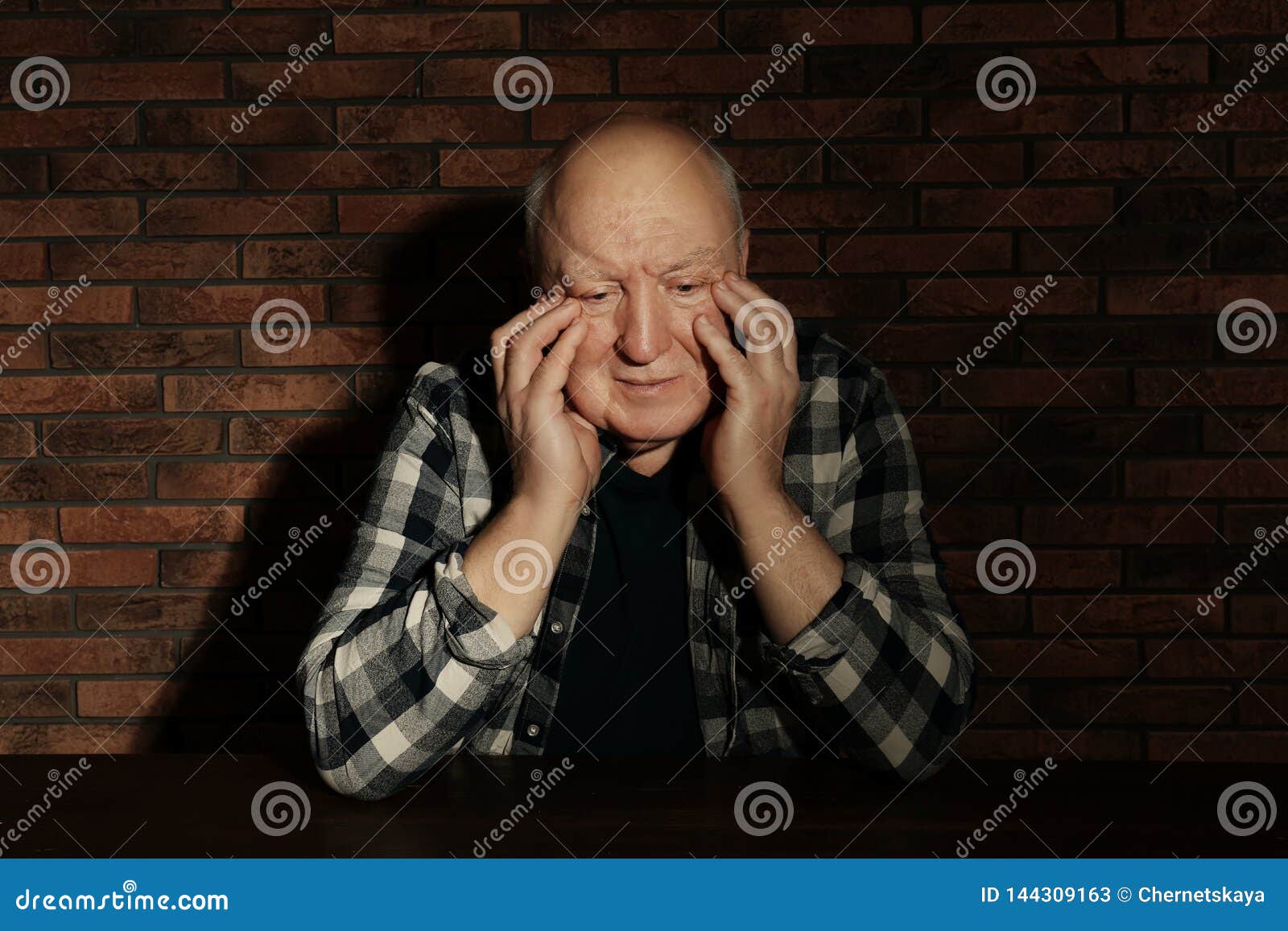 Poor Senior Man Sitting at Table Near Wall Stock Image - Image of ...