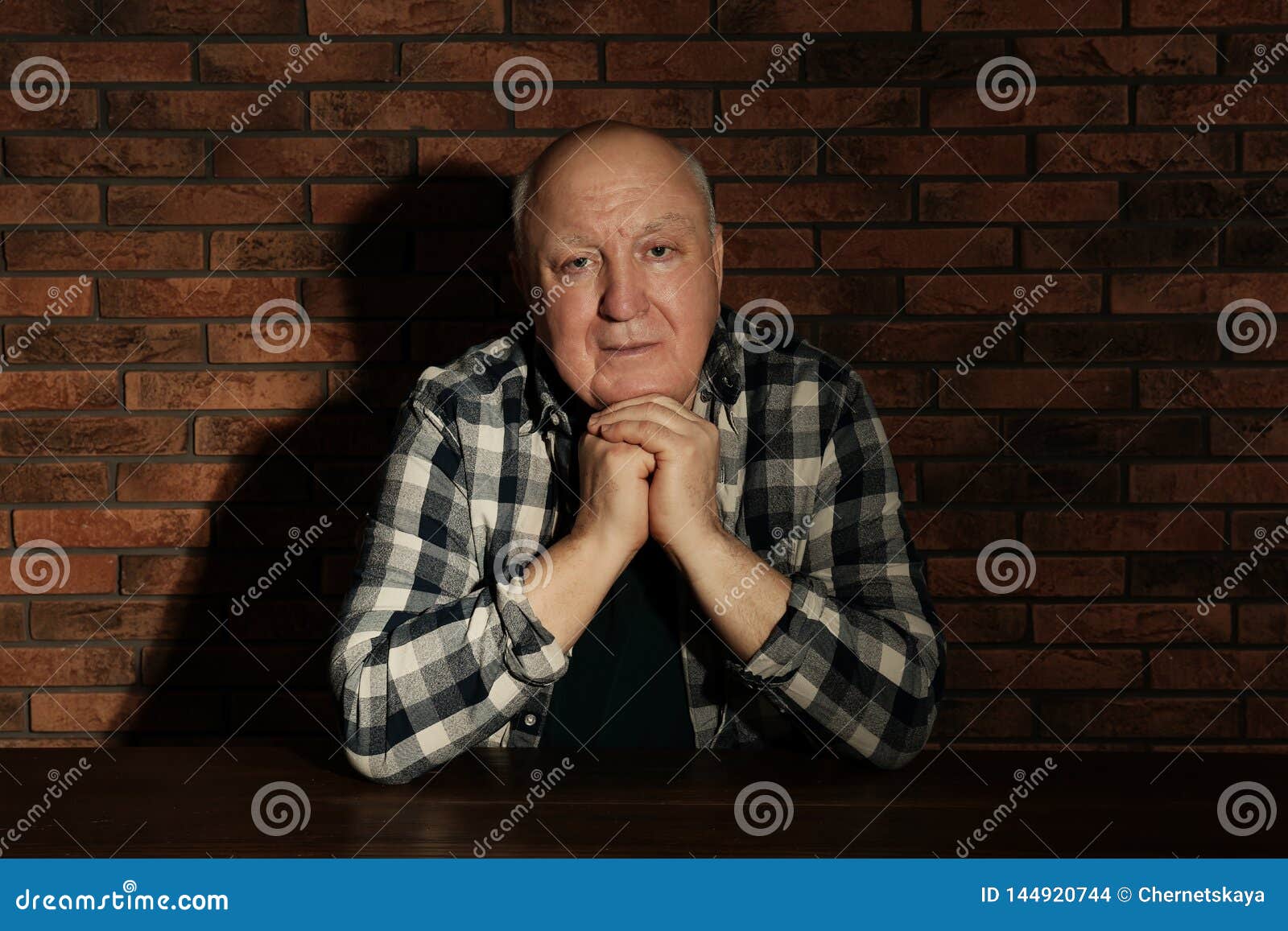 Poor Senior Man Sitting at Table Near Wall Stock Photo - Image of ...