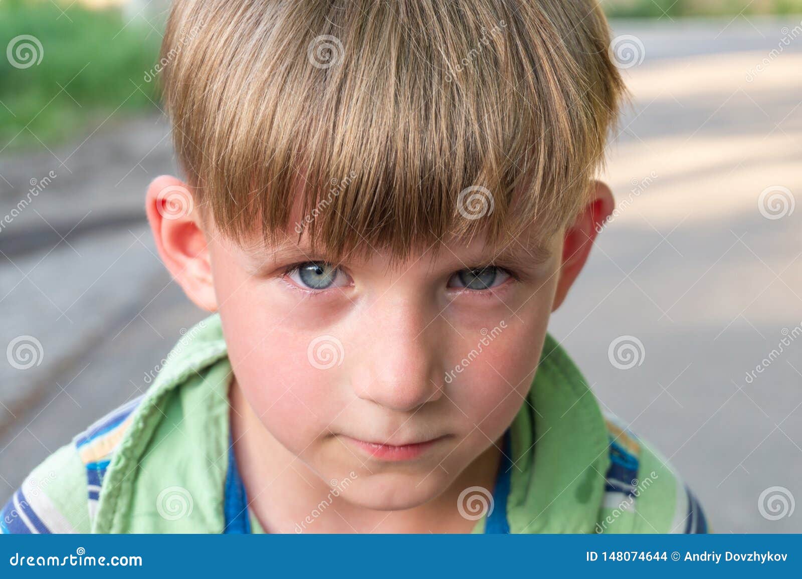 Poor And Unhappy Orphan Boy, Sitting On The Ruins And Ruins Of A ...