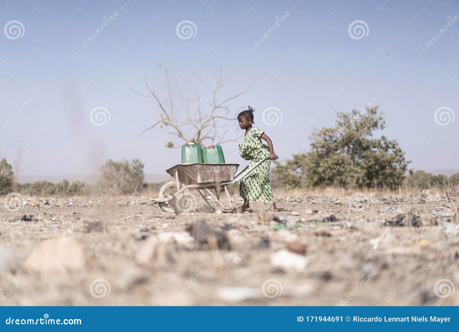 Poor West African Infant Working with Nutritious Water in a Natural ...