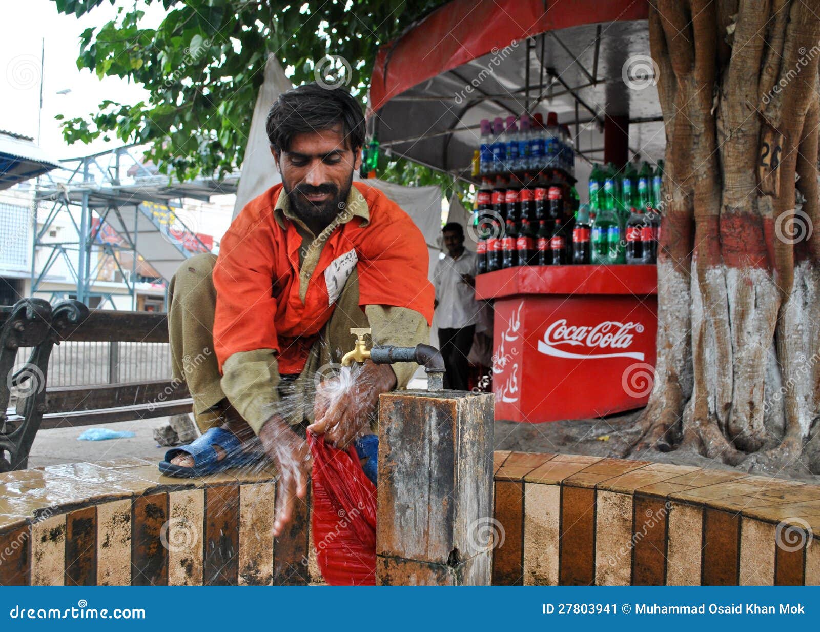 Poor Worker Washes His Cloths at Station. Editorial Photo - Image of ...