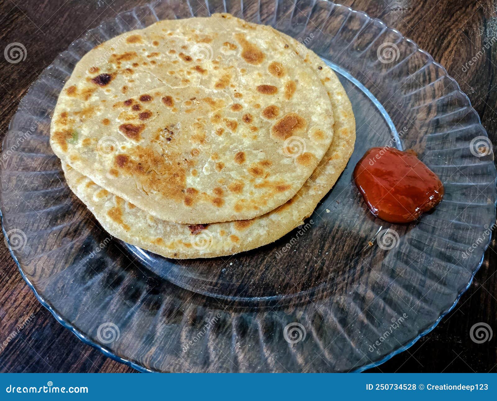 Poori an Ideal Indian Breakfast Served with Tomato Sauce Stock Photo ...