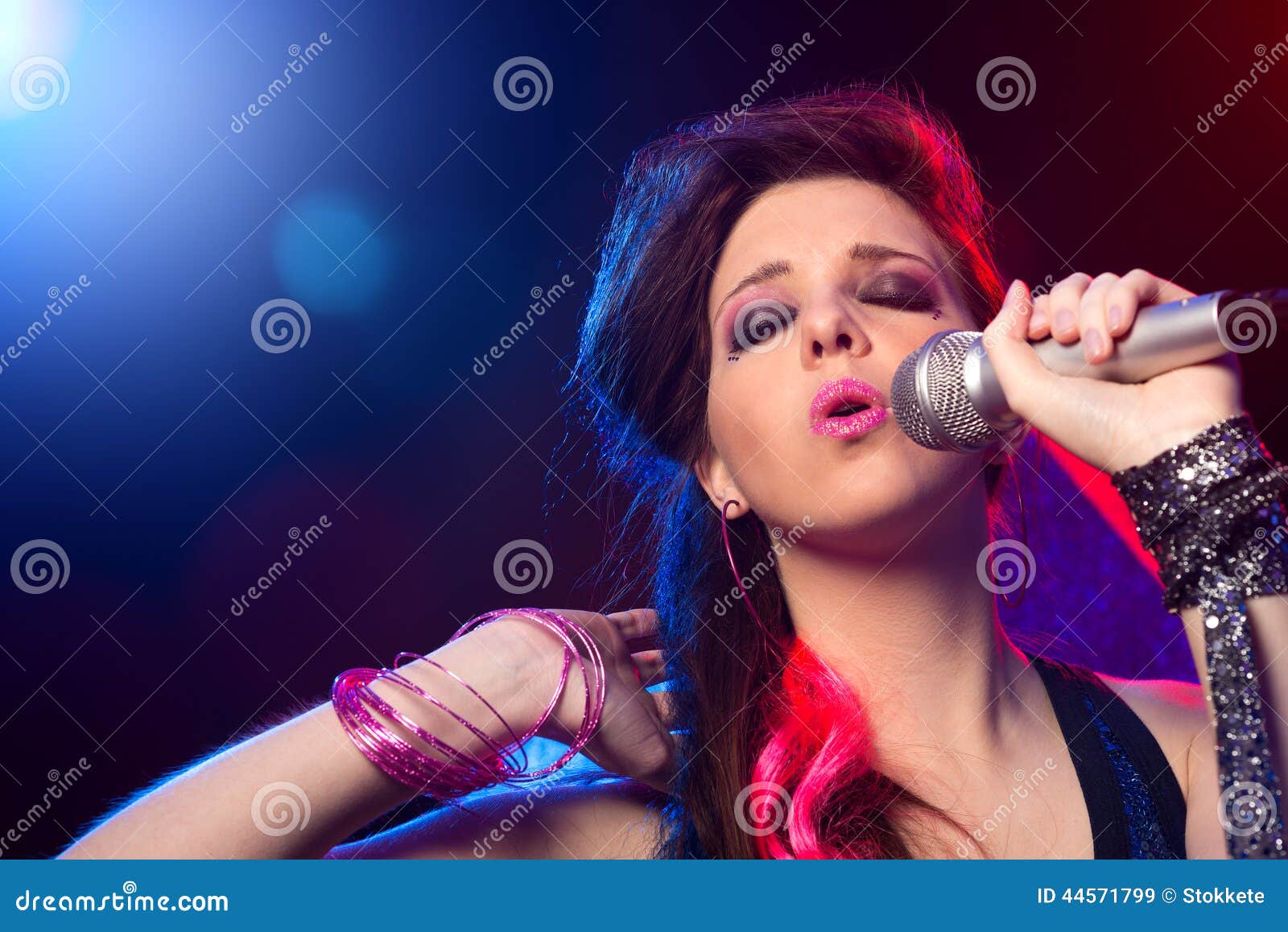 Pop star singing on stage stock image. Image of teenager - 44571799