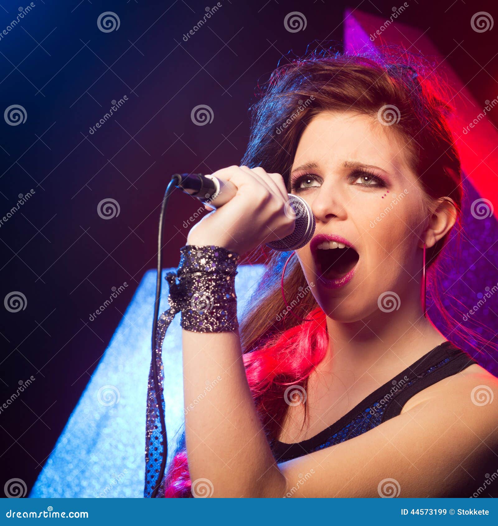 Pop star singing on stage stock image. Image of light - 44573199