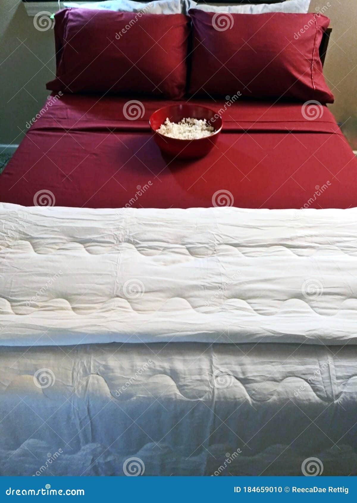 Popcorn on bed stock photo. Image of flooring, clothing - 184659010