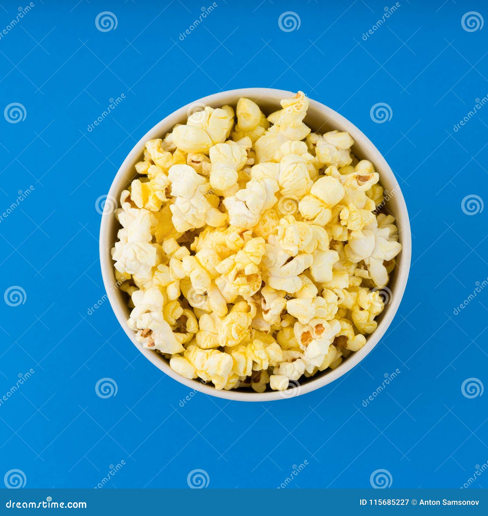 Air Popcorn On A Blue Background With Three Grains In The Form Of A ...