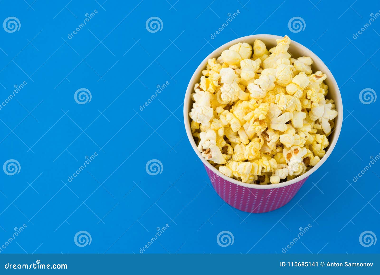 Popcorn blue background stock image. Image of full, bowl - 115685141