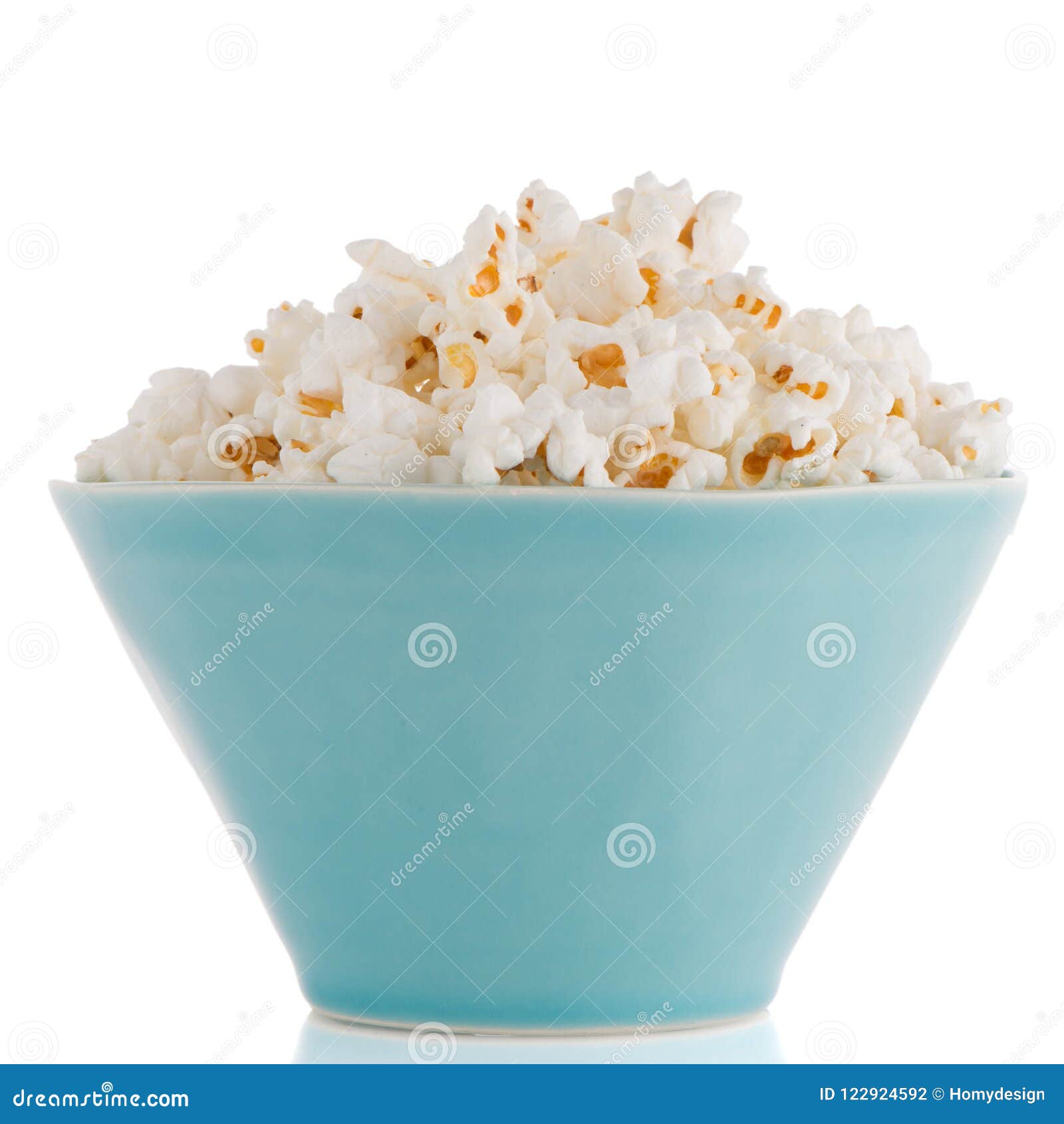 Popcorn in a blue bowl stock photo. Image of crunchy - 122924592