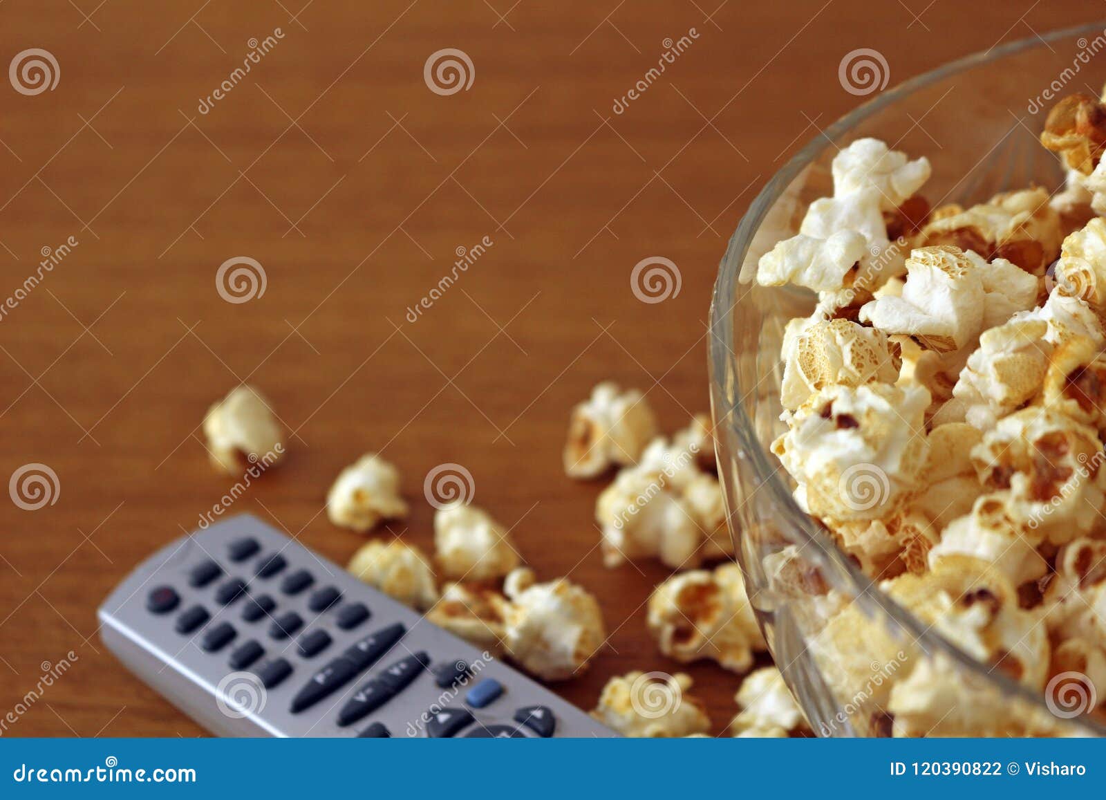 Popcorn and TV controller stock photo. Image of golden - 120390822