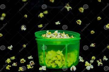 Popcorn Bucket with Falling Popcorn and Black Background Stock Image ...