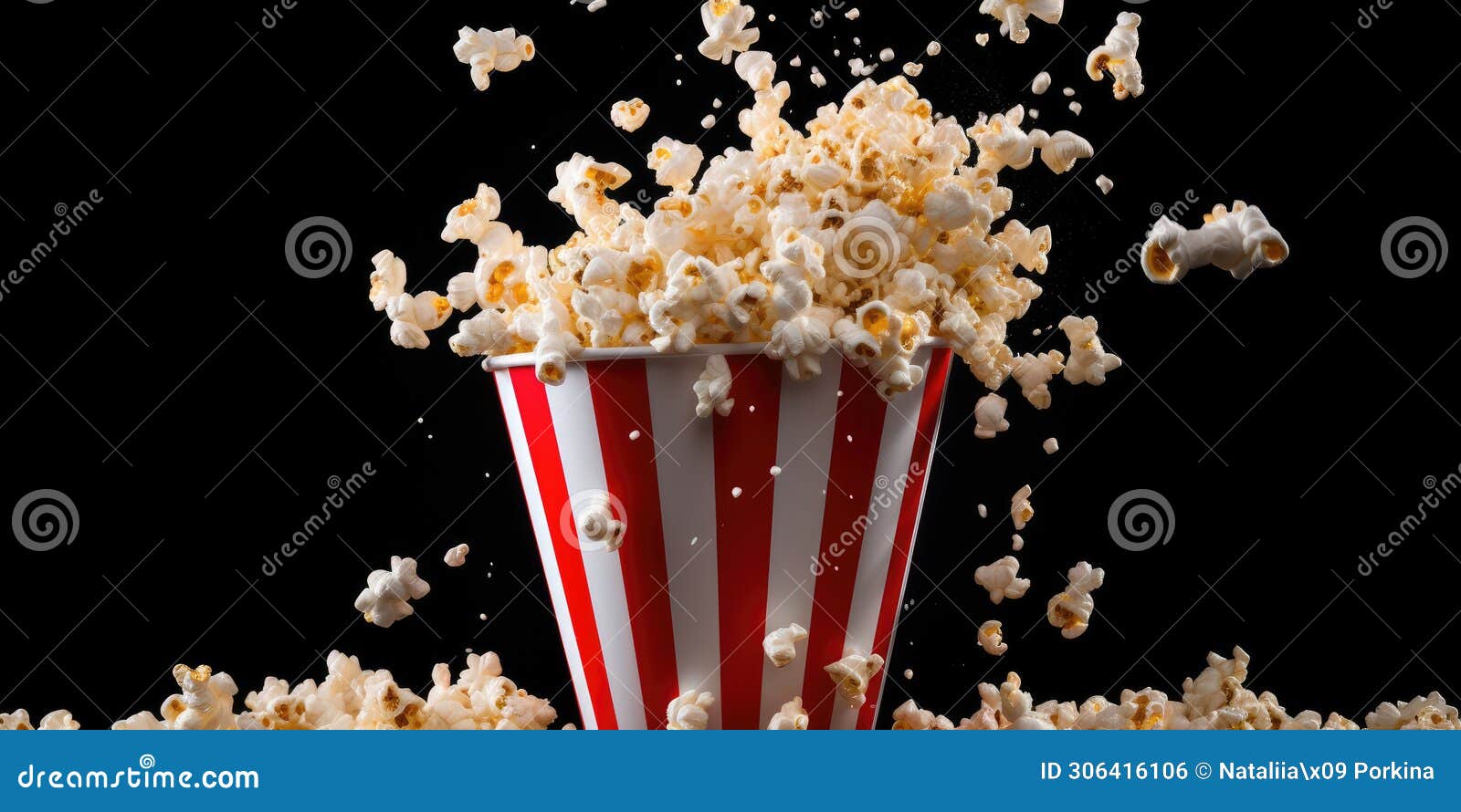 Popcorn Exploding Inside the Striped Cardboard Bucket on Black ...