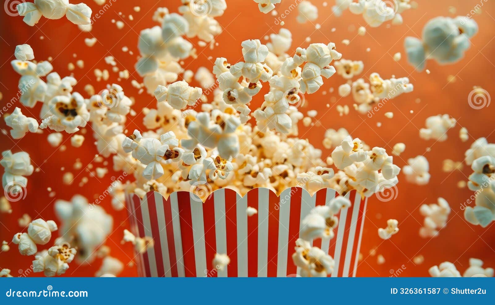Popcorn Exploding Joyfully from a Classic Striped Container Capturing ...