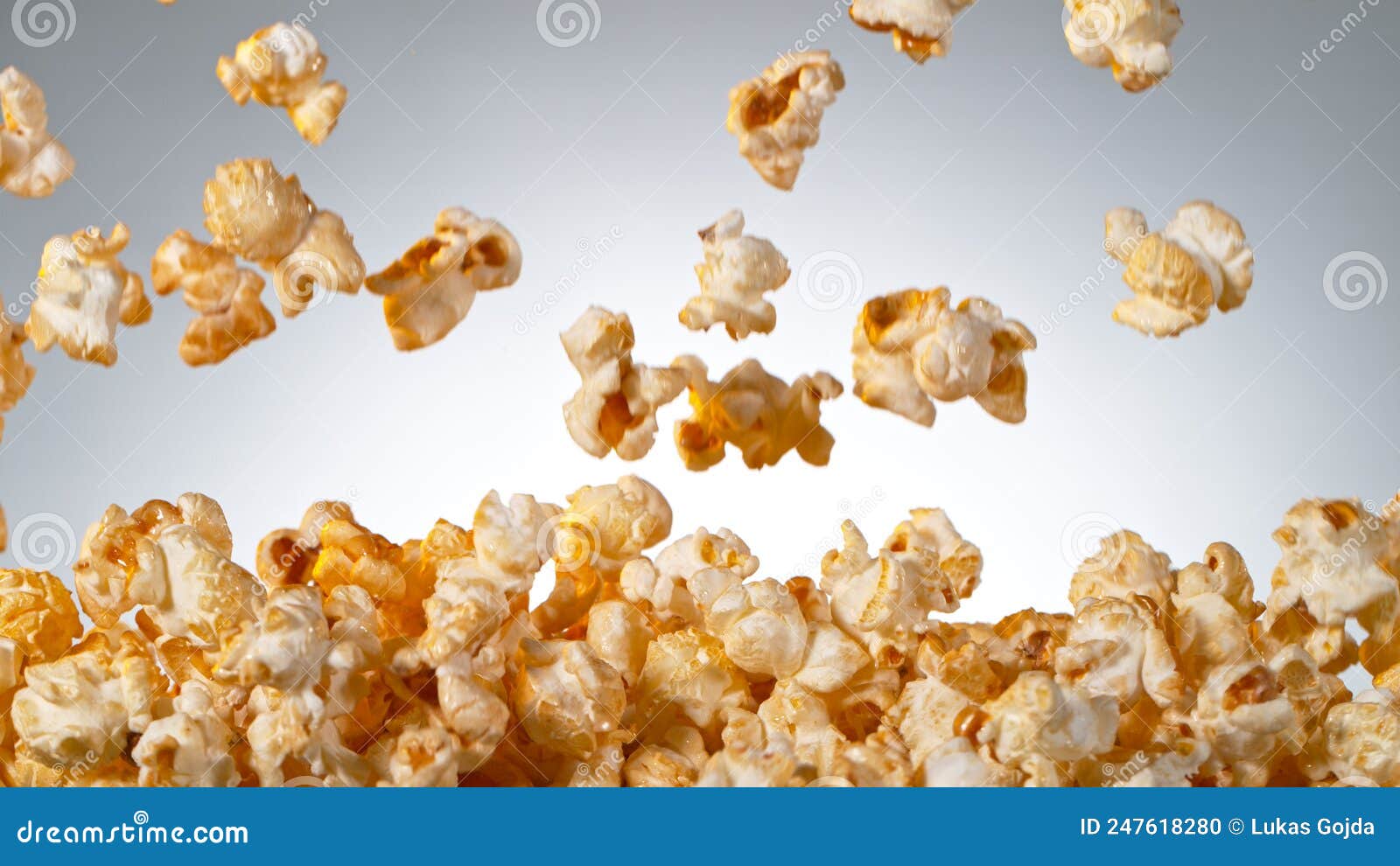 Popcorn Falling on Gradient Grey Background. Stock Photo - Image of ...