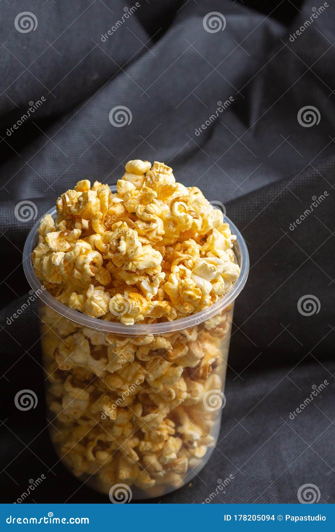 Popcorn in a large bucket stock photo. Image of container - 178205094