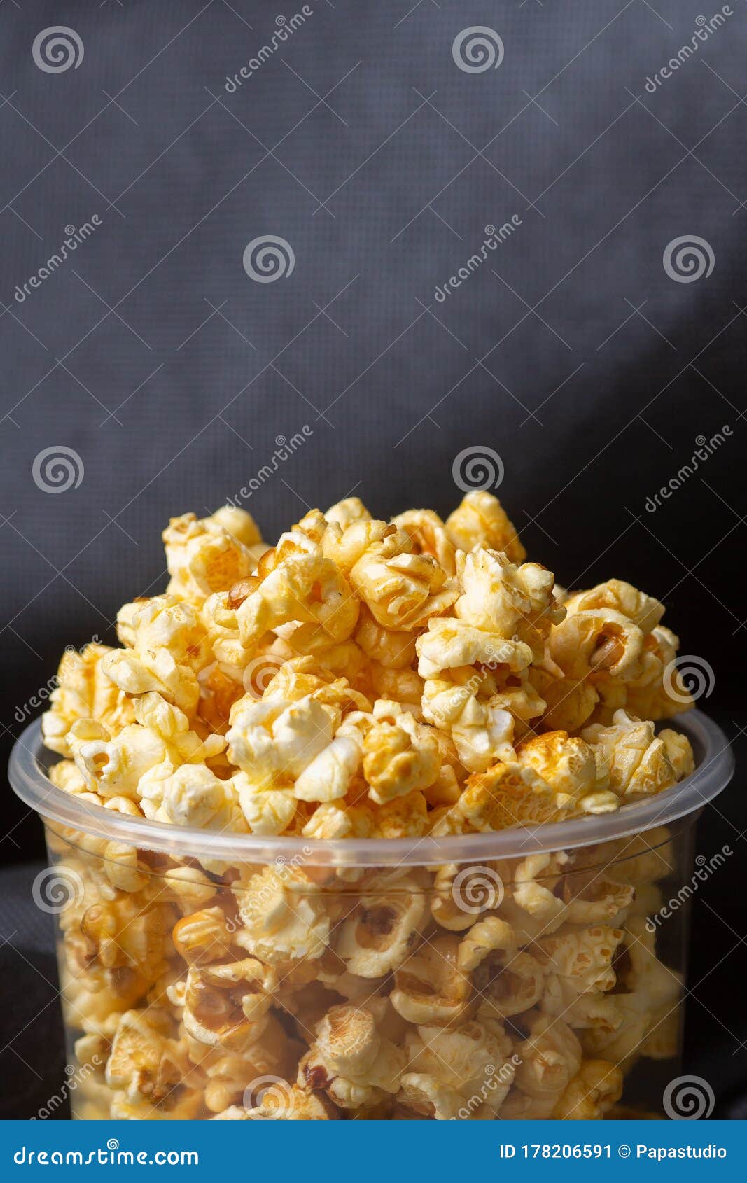 Popcorn in a large bucket stock image. Image of entertainment - 178206591