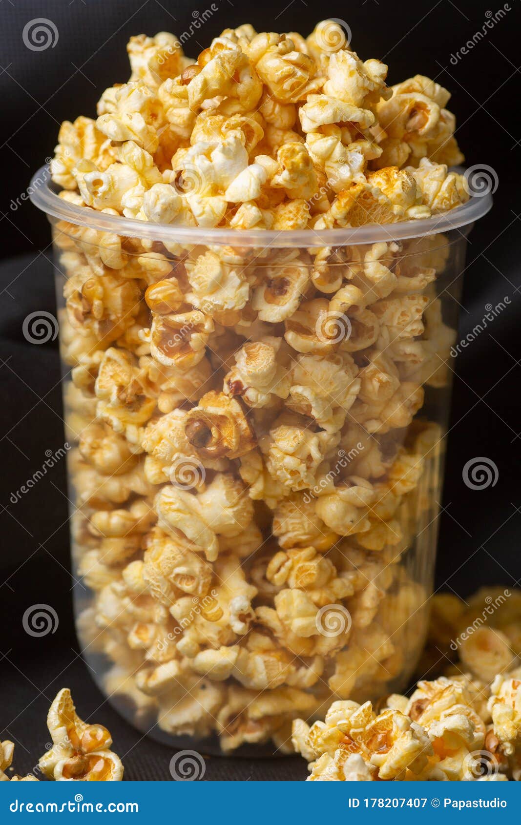 Popcorn in a large bucket stock image. Image of salt - 178207407
