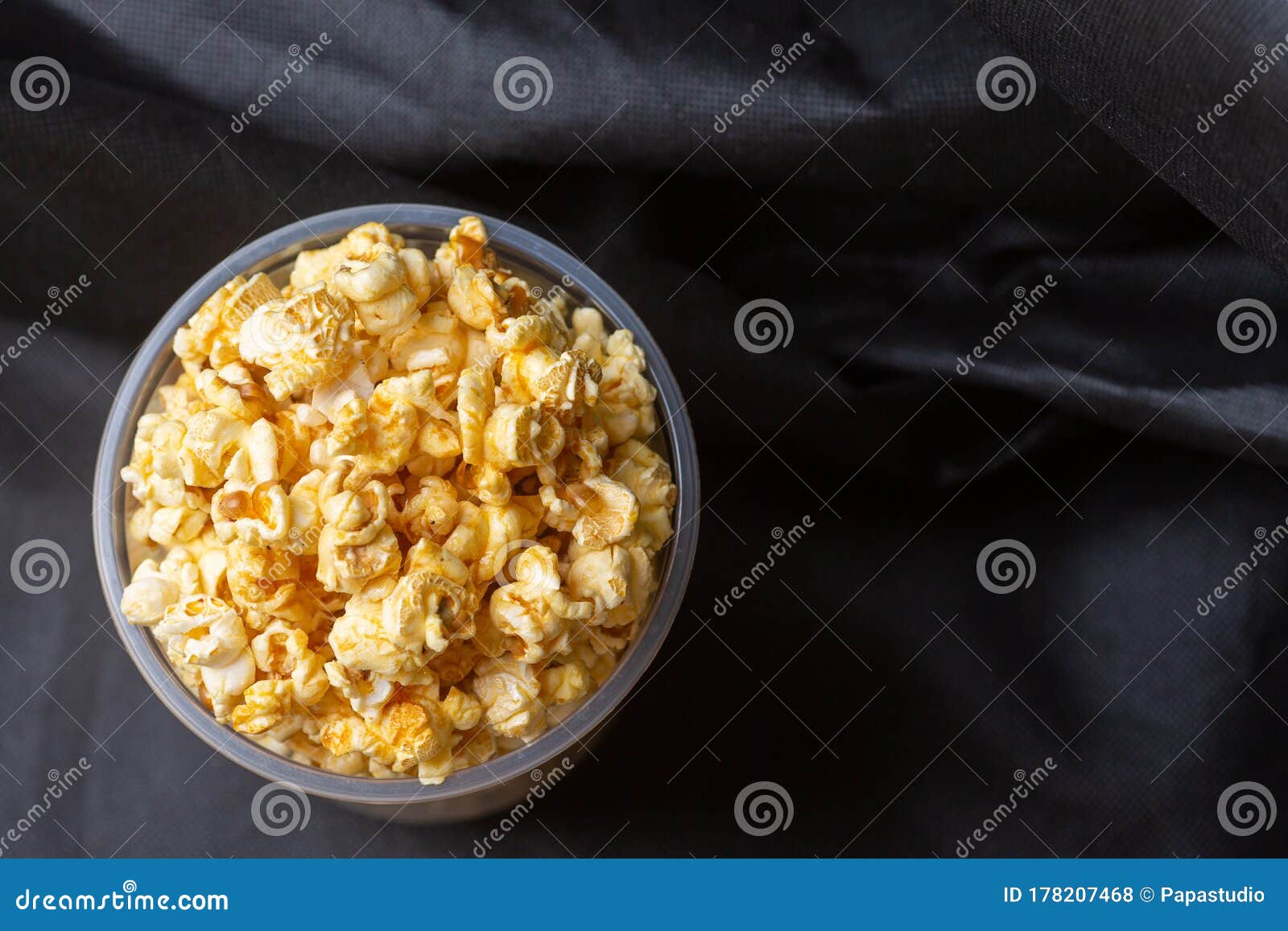 Popcorn in a large bucket stock photo. Image of isolated - 178207468