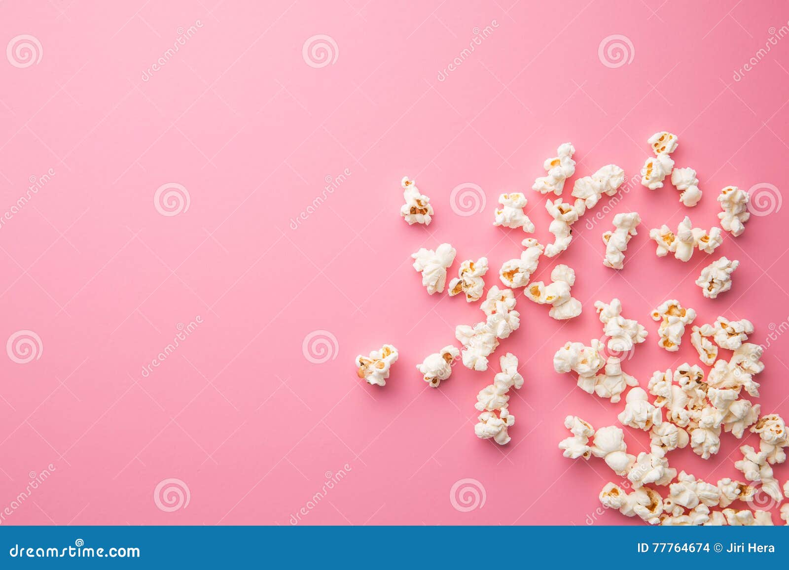 Popcorn on pink background stock photo. Image of flat - 77764674