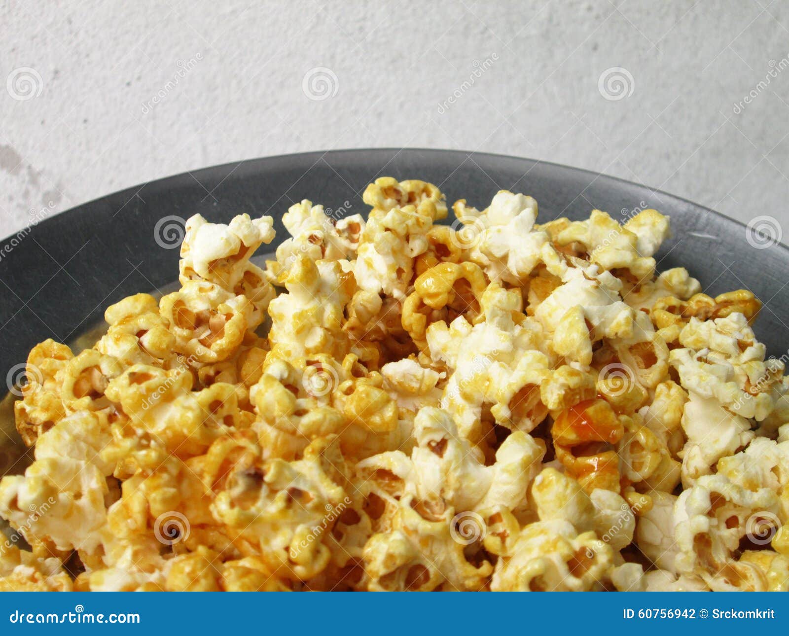 Popcorn on plate stock photo. Image of buttered, objects - 60756942