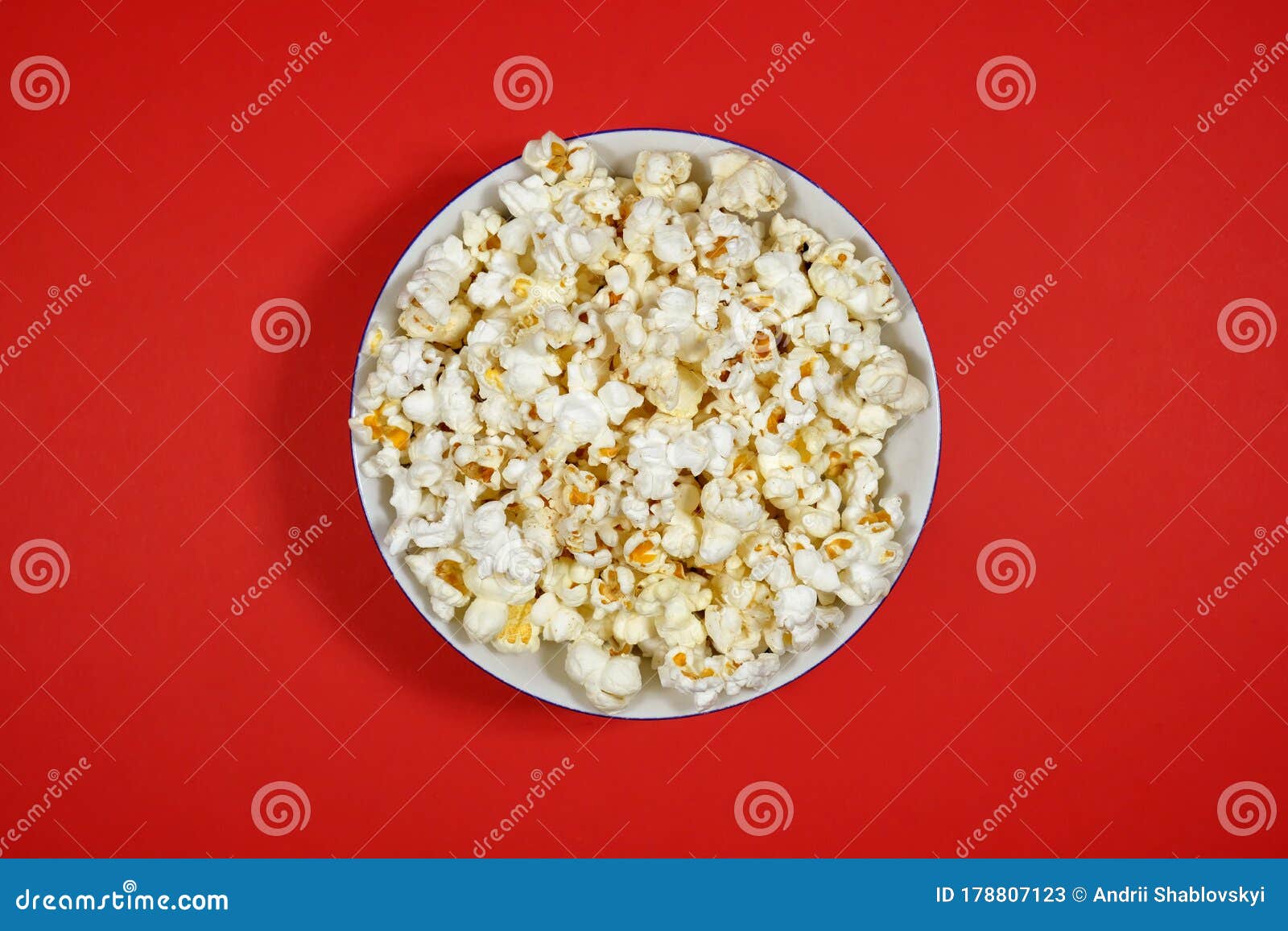 Popcorn in a Plate on a Red Paper Background. Close-up, Top View Stock ...