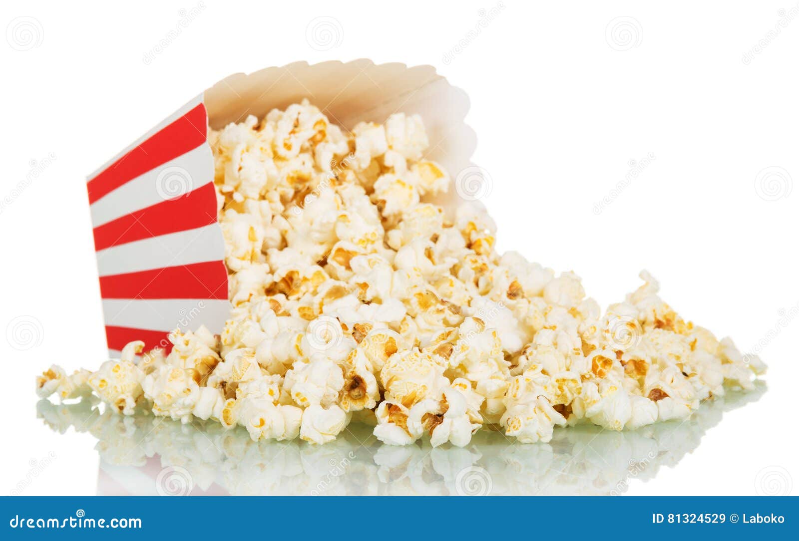 Box Of Popcorn Spilled On Blue Background. Stock Photography ...