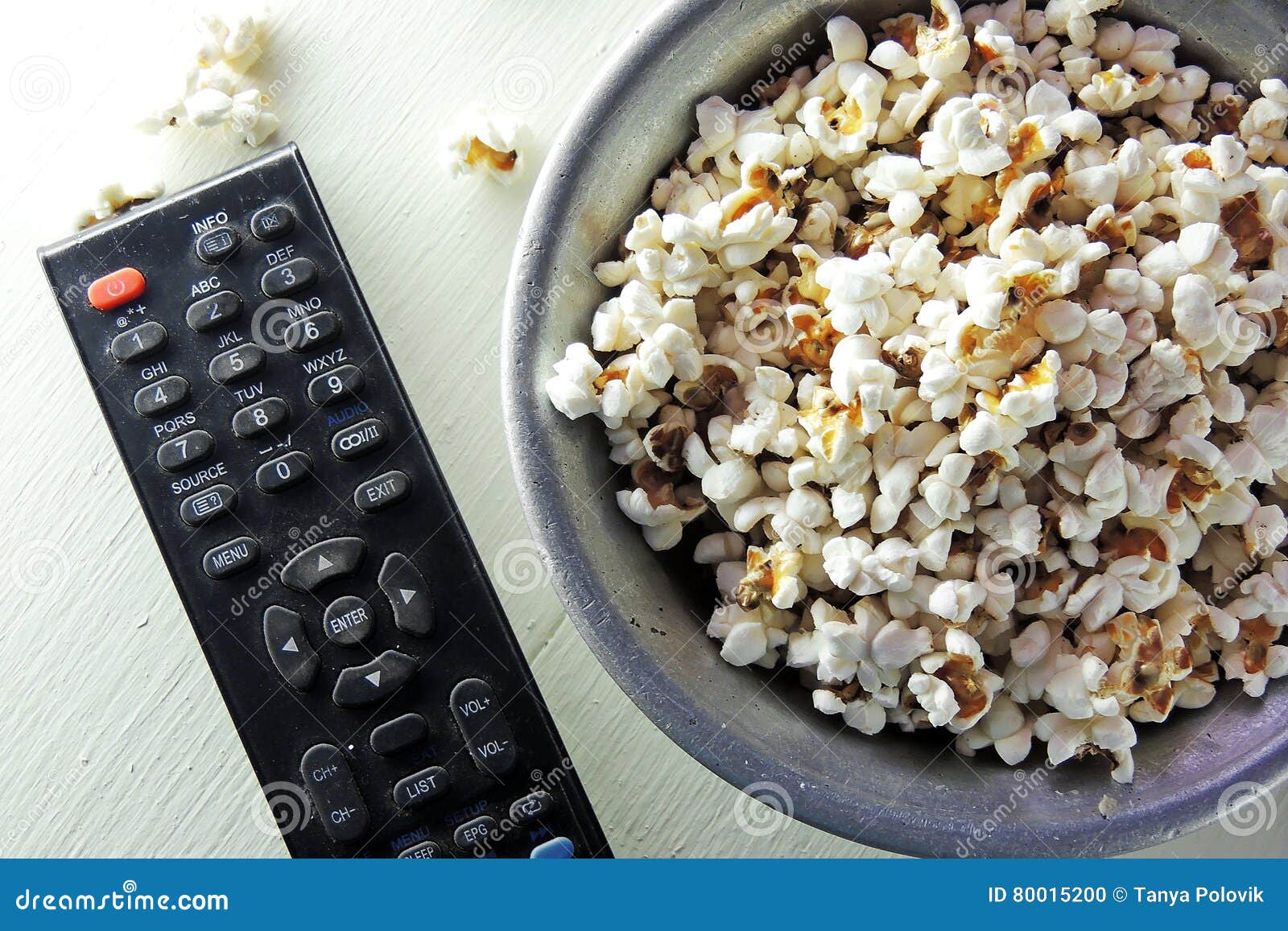 Popcorn and the TV remote stock photo. Image of heap - 80015200