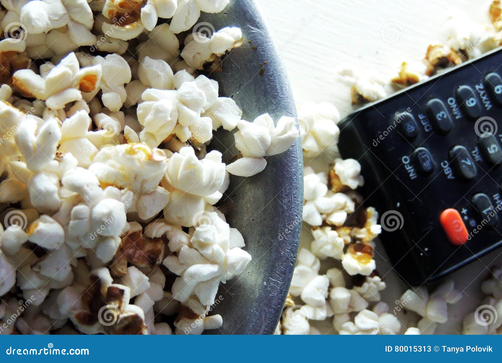 Popcorn and the TV remote stock image. Image of infrared - 80015313