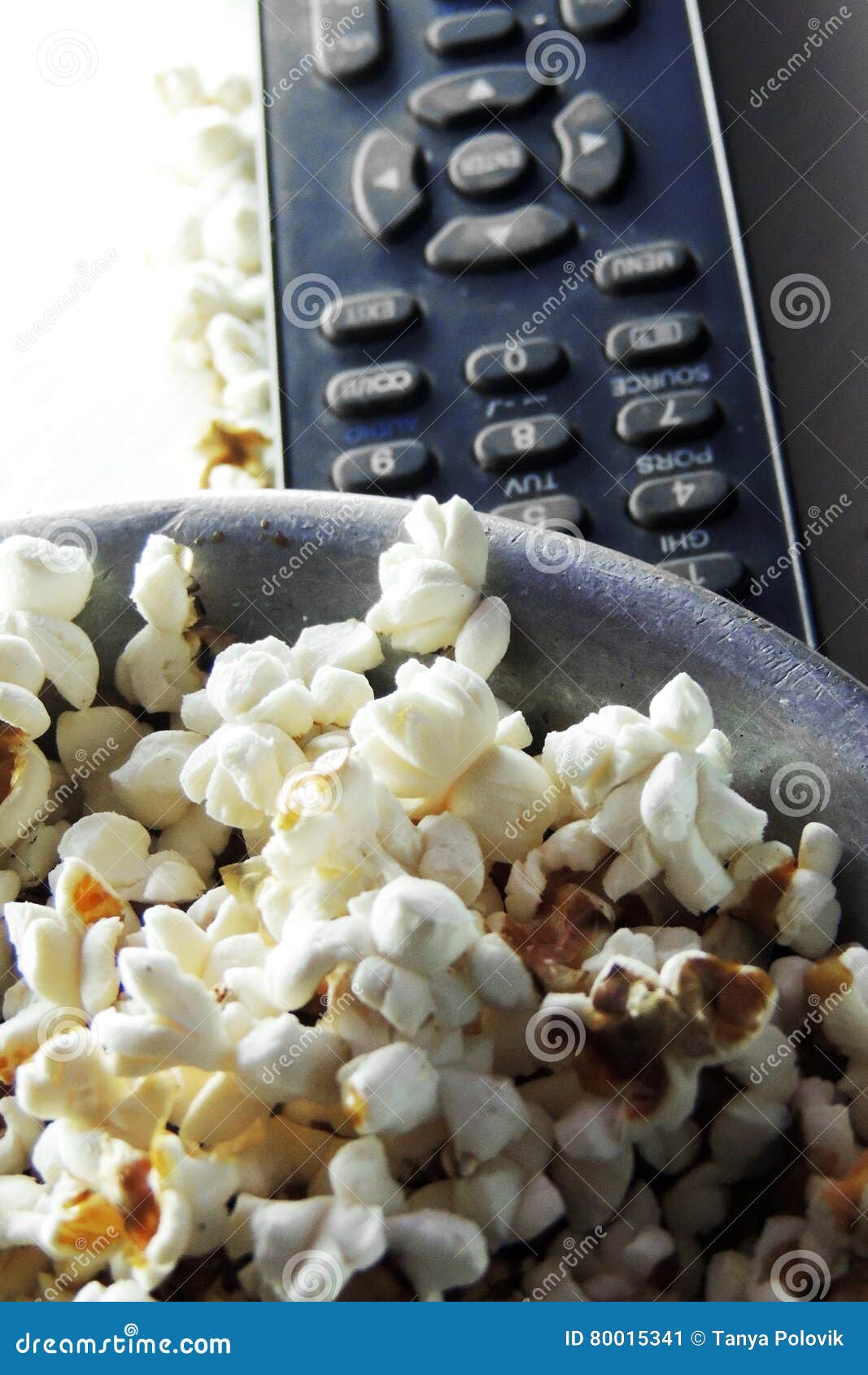 Popcorn and the TV remote stock image. Image of design - 80015341