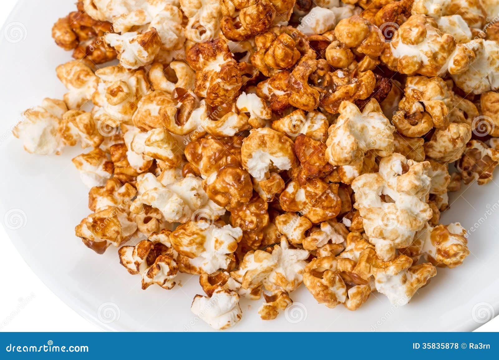 Popcorn on a white plate stock photo. Image of isolated - 35835878