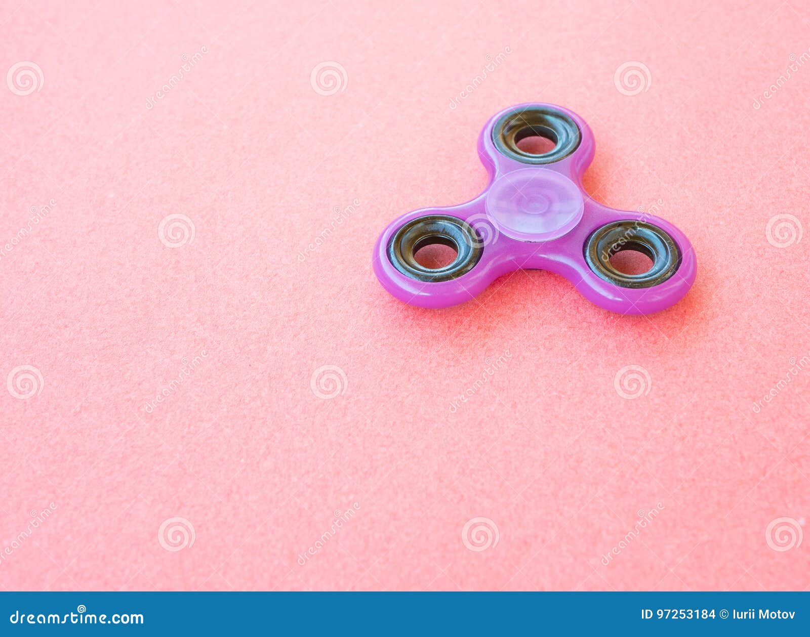 Popular Colourful Fidget Spinner Toy on a Colored Background Stock ...