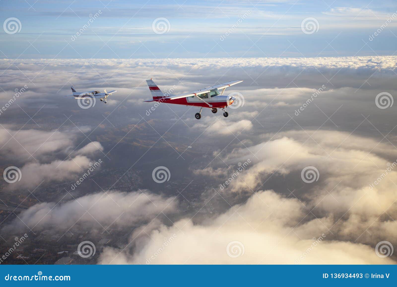 Popular Single-engine Airplane Flying through the Clouds on a Beautiful ...